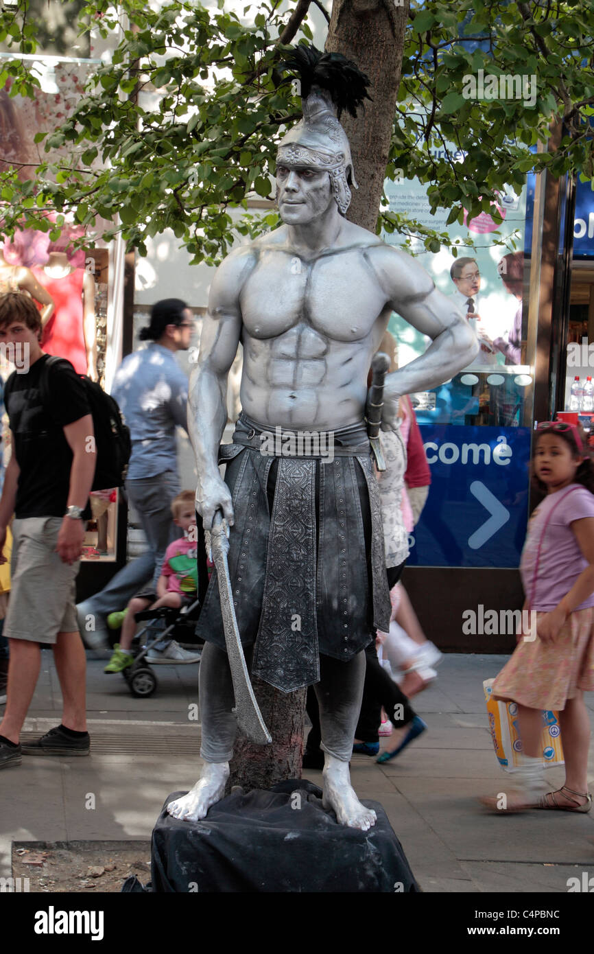 A street entertainer, dressed as a scary Roman Centurion in Covent ...