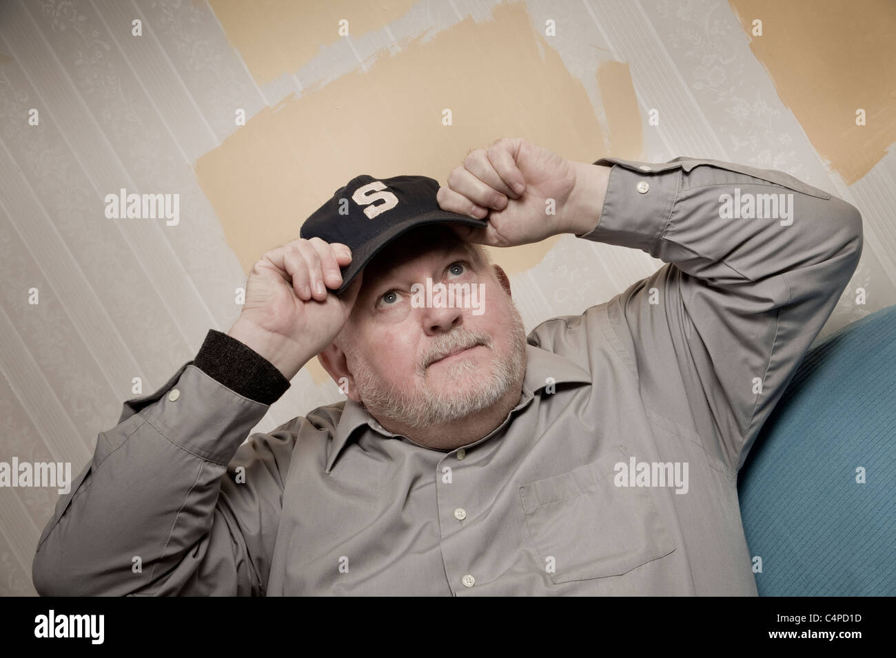 Middle-aged man wearing a baseball cap Stock Photo - Alamy