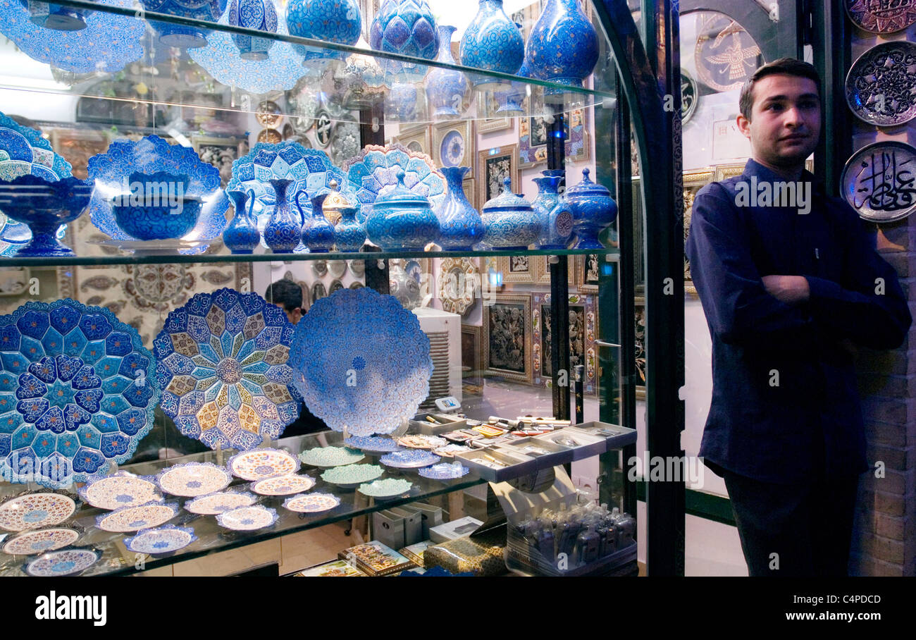 Man in handicrafts shop selling souvenirs, Isfahan, Iran Stock Photo ...