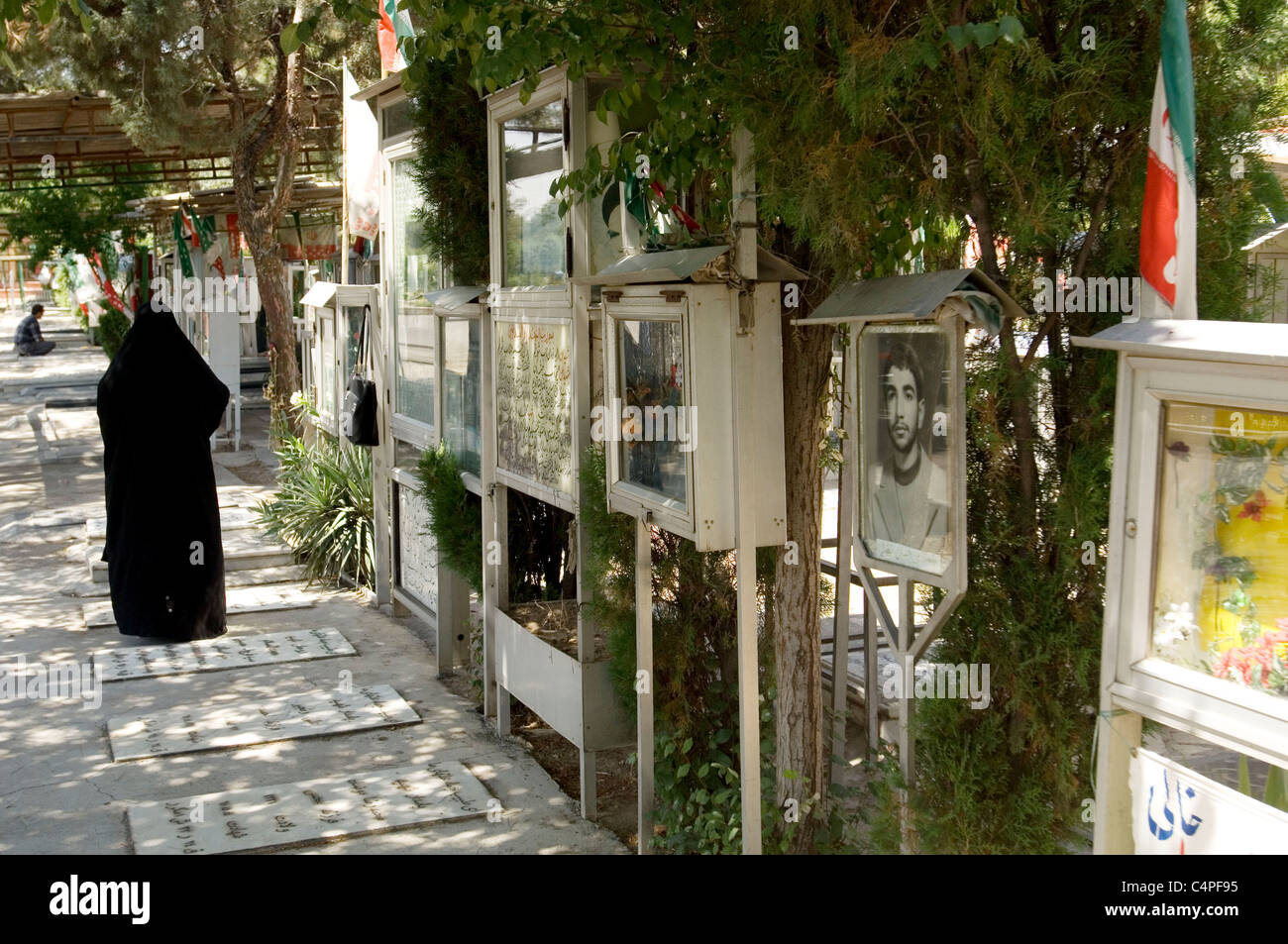 Woman at Behesht-e Zahra cemetery, area dedicated to the fallen during ...