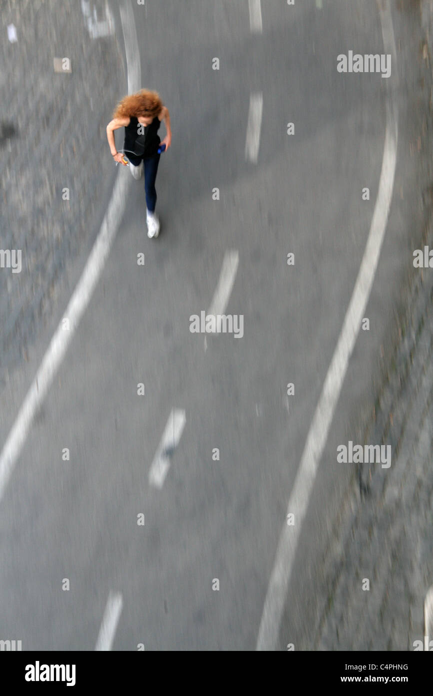 woman running on cycle path Stock Photo - Alamy