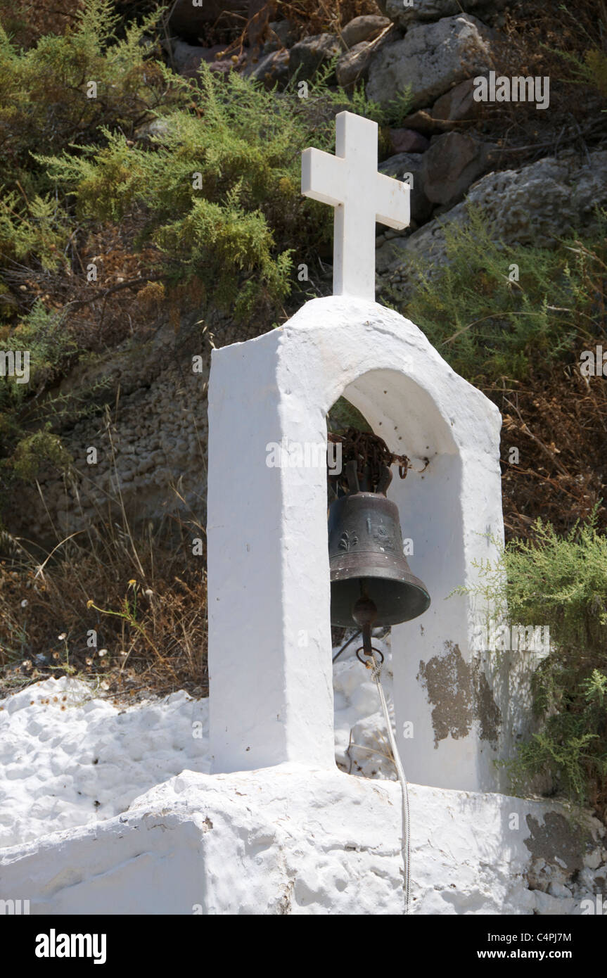 Bell and cross of the chapel in the rock near the Catacombs on Milos ...