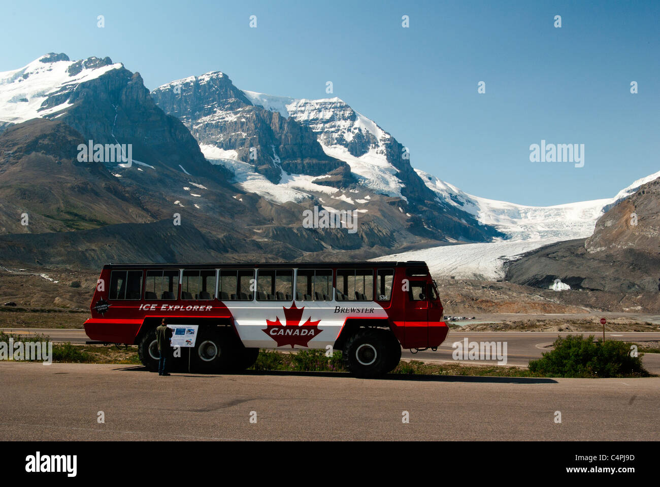 Man by tour bus at the Athabasca Glacier, Columbia Icefield, Jasper ...