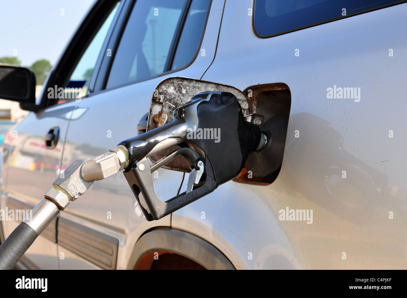 Filling up the car at a gas station and paying for it Stock Photo - Alamy