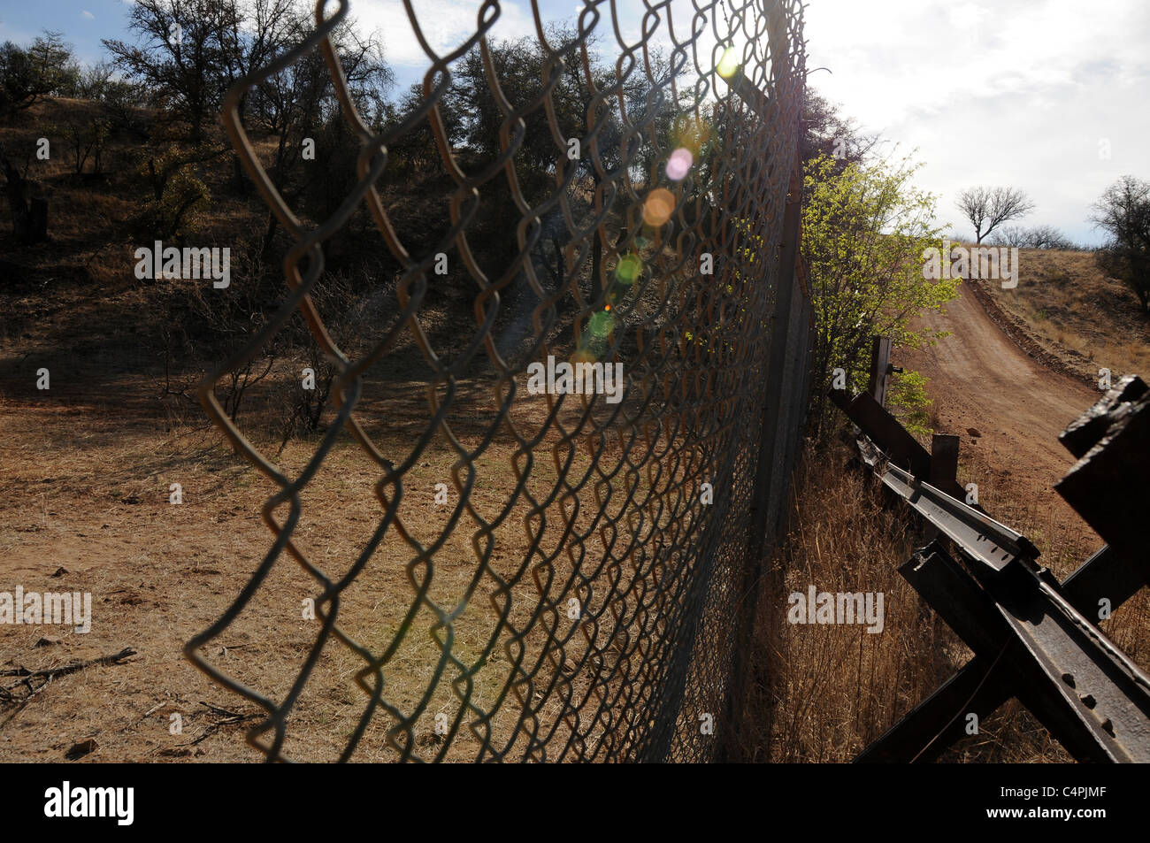 Holes cut in the fence at the Mexican border between Sonora and Lochiel ...