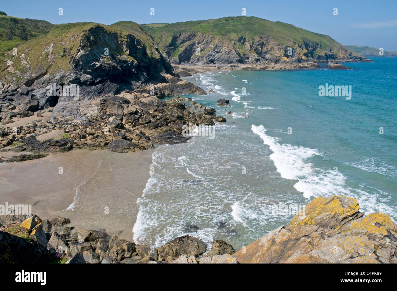 Lundy Bay beach on the north Cornwall coast, with Carnweather Point in ...