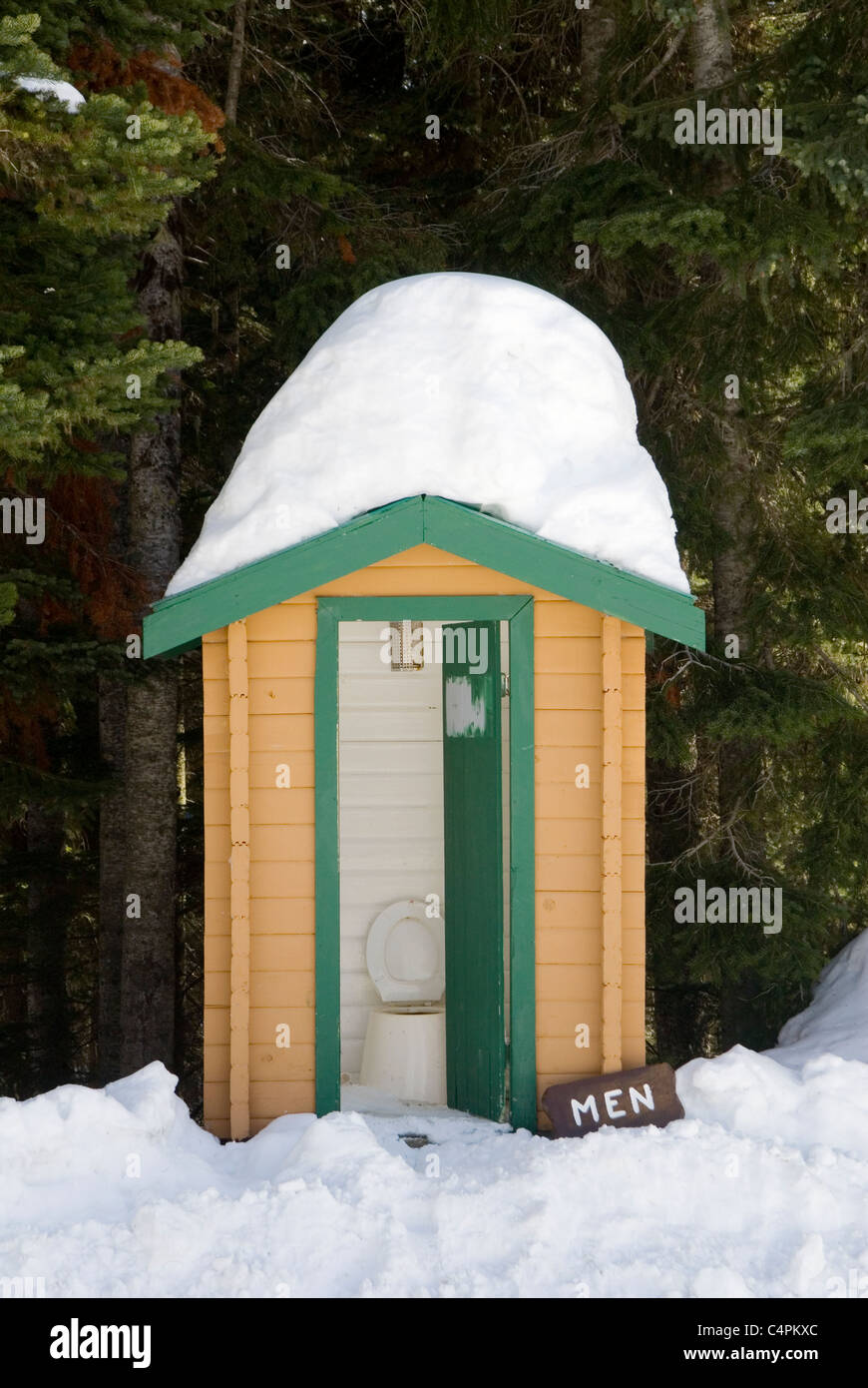 Men's outhouse covered in snow and with the door open at Manning ...