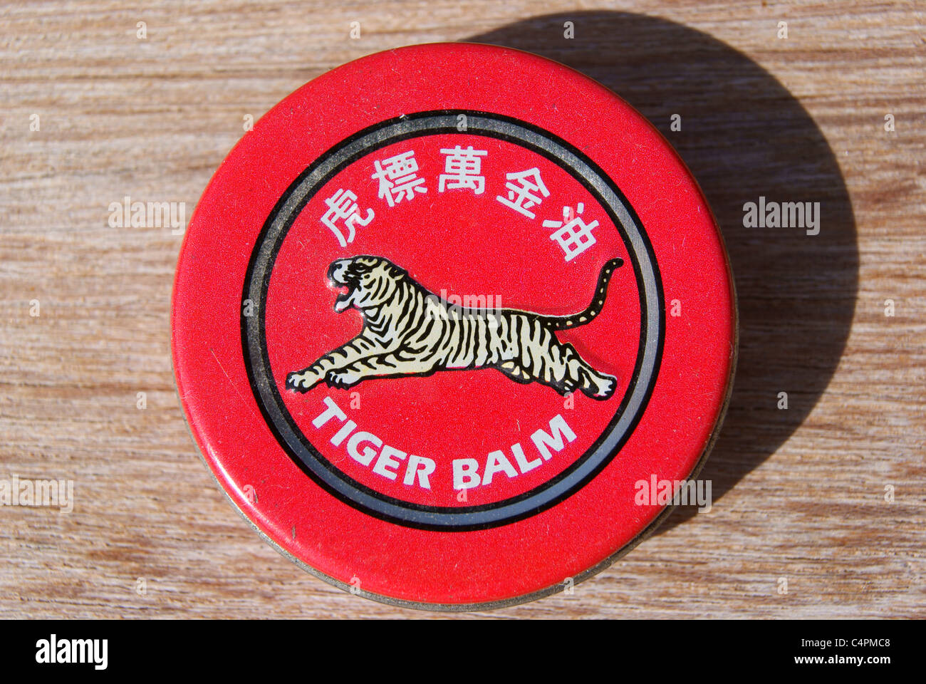 Tiger balm tin Stock Photo - Alamy