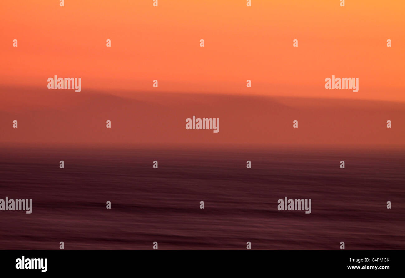 Soft Mauve Sunset Over Ocean Stock Photo - Alamy