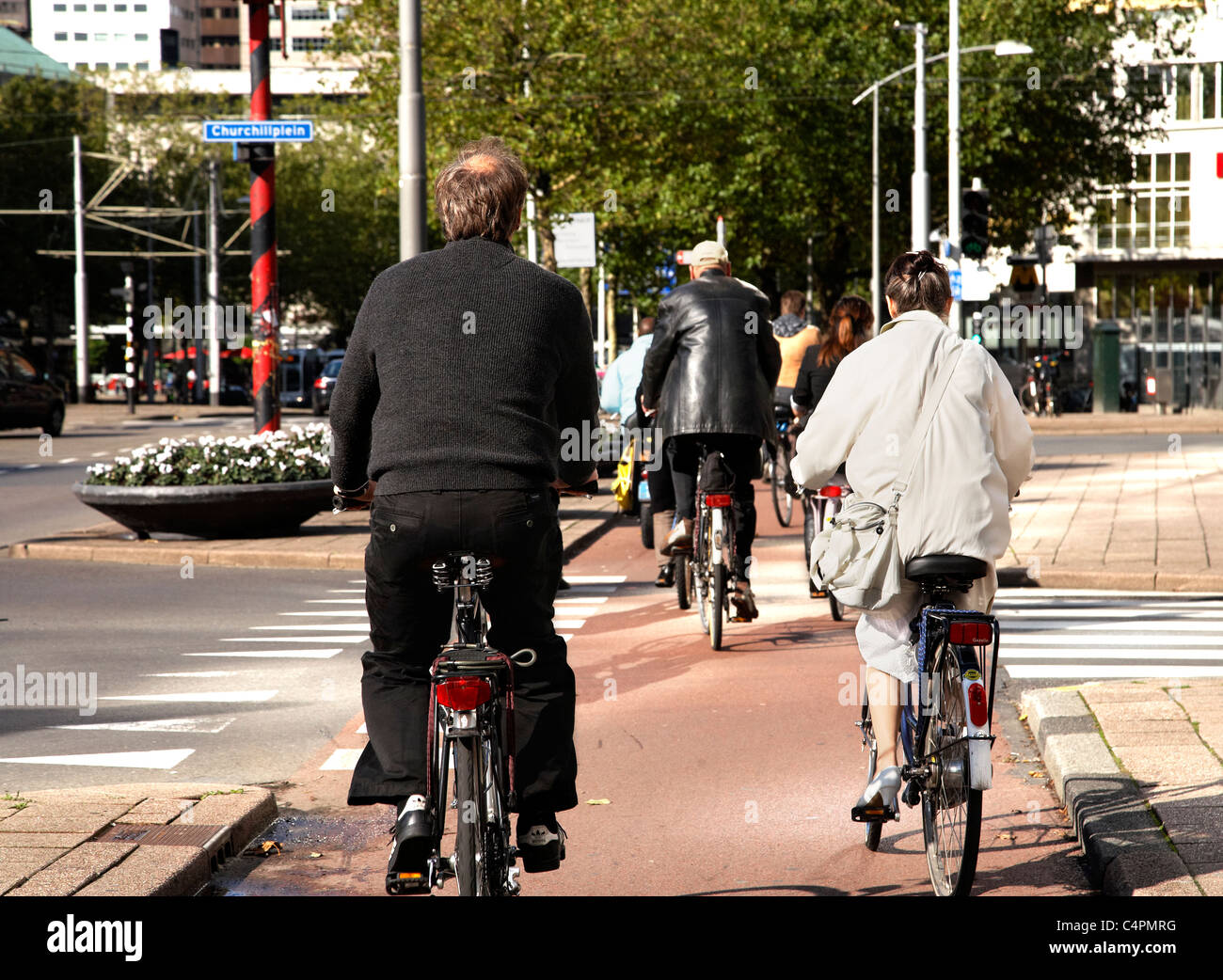 Cyclist crossing the road in Rotterdam Stock Photo - Alamy