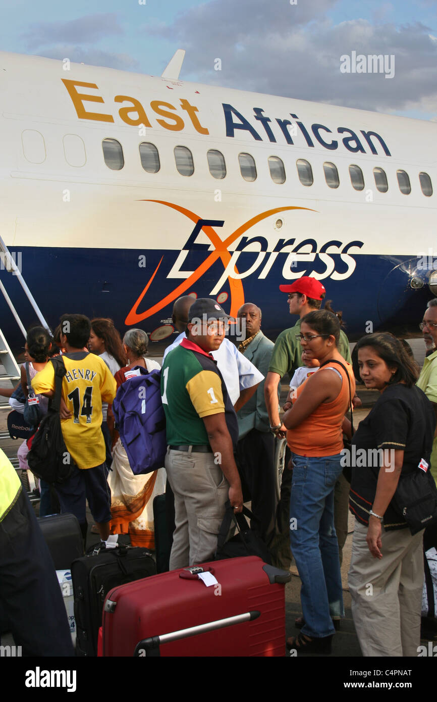 East African Express plane passengers boarding Stock Photo - Alamy