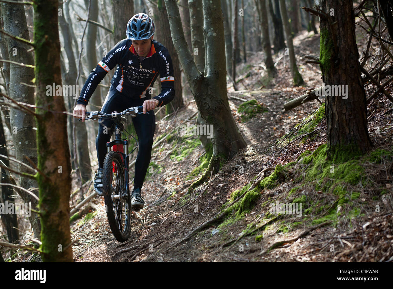 Irish mountain biking champion Robin Seymour rides a trail through a ...