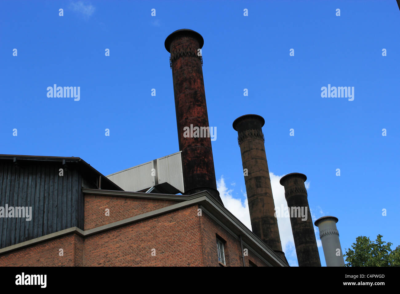 Row of chimneys against blue sky hi-res stock photography and images ...