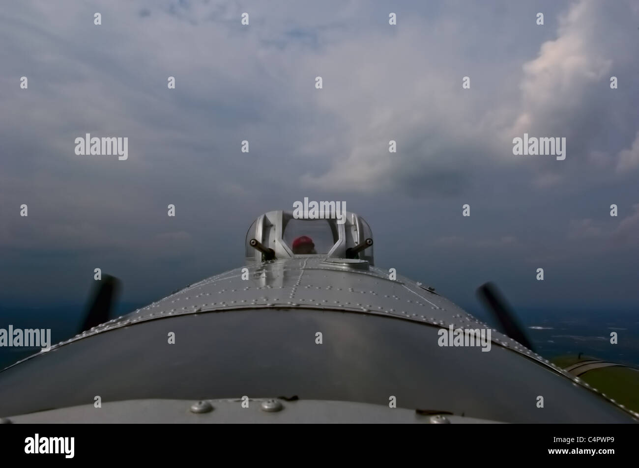 Passenger looking through machine gun turret of restored World War II B ...