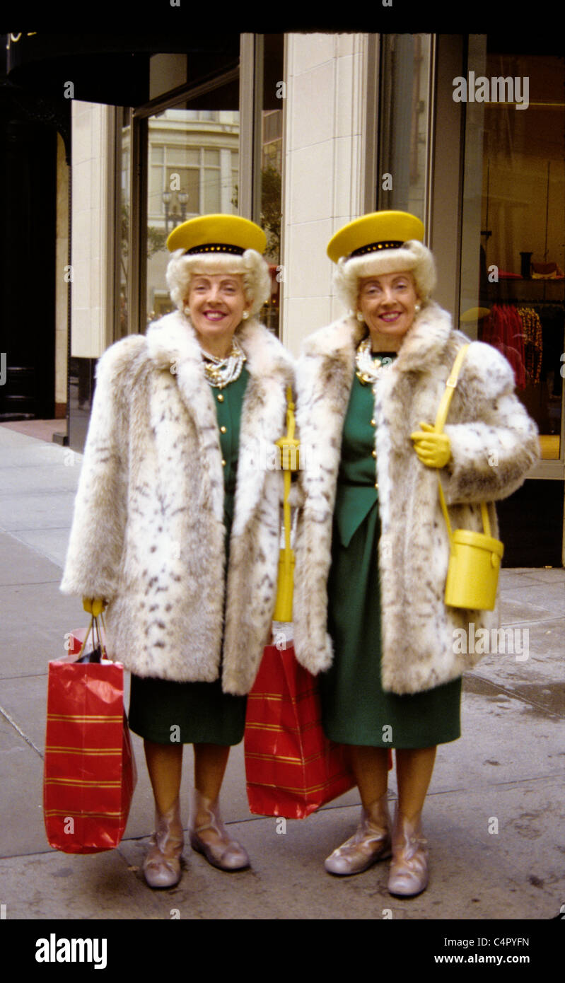 two famous identical San francisco twin wearing identical outfits pose ...