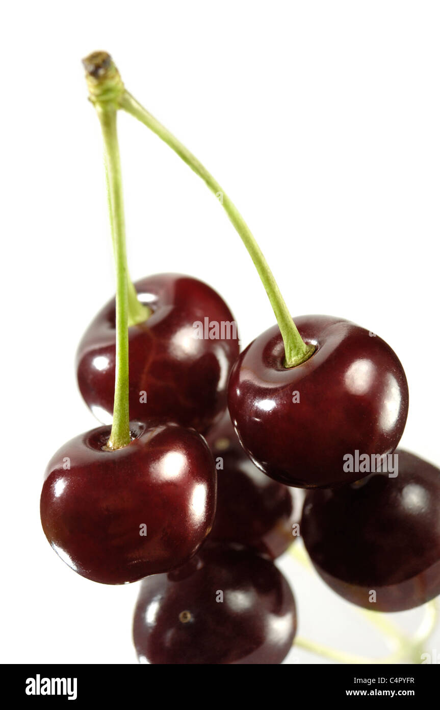 Three cherries close-up Isolated on white background Stock Photo - Alamy