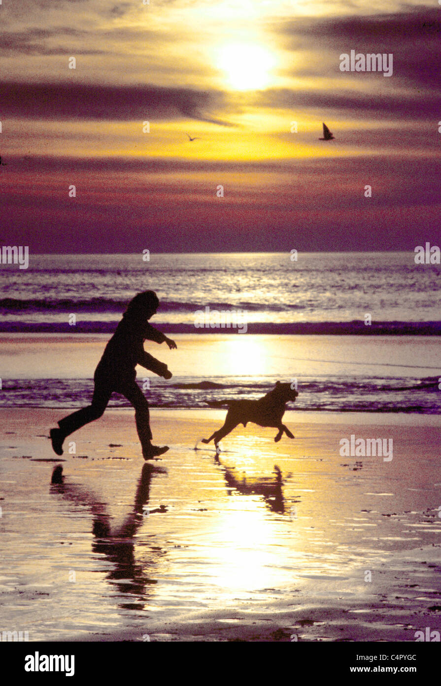 Woman running on beach 1970s hi-res stock photography and images - Alamy
