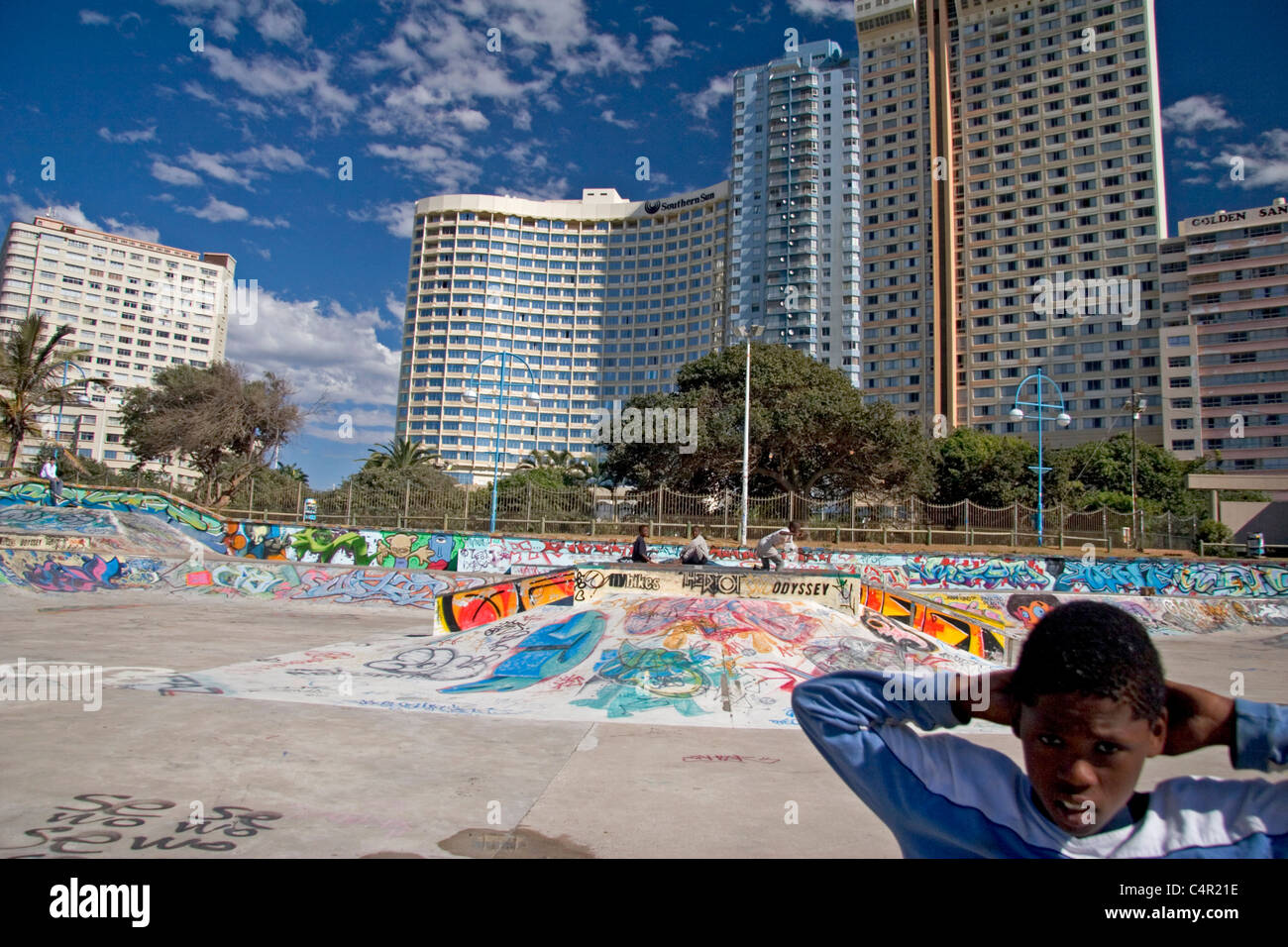 Kids skateboarding along the Durban Beach boardwalk, Durban, South ...
