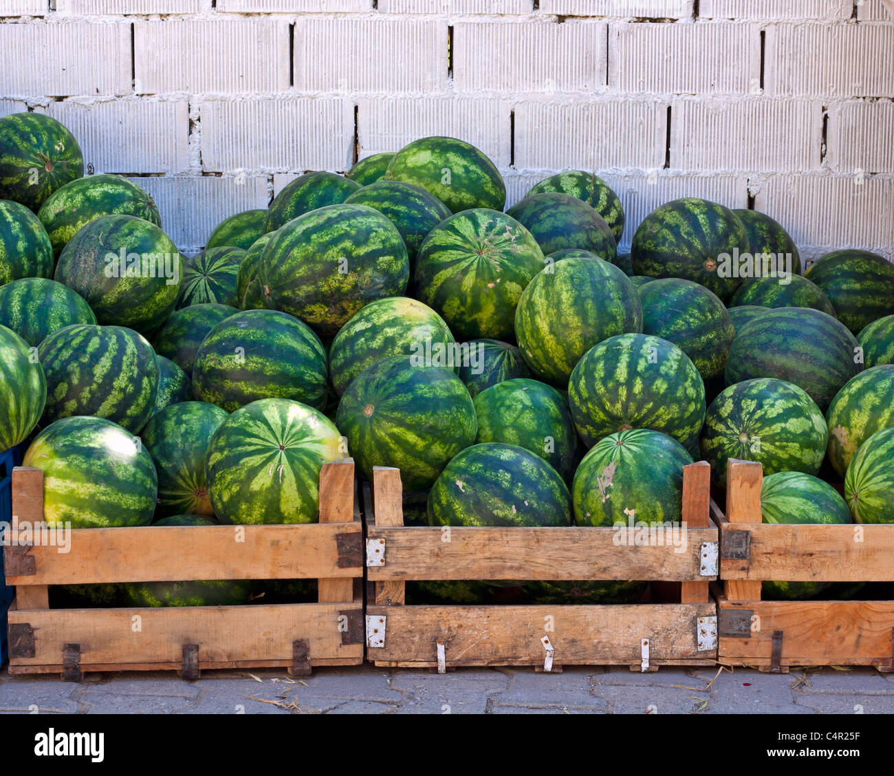 Watermelons stacked on pavement in Turkish street market Stock Photo ...