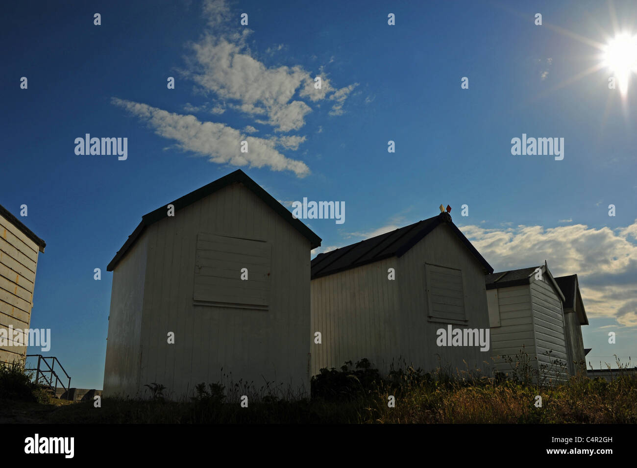 Beach huts on the beach at Ferring near Worthing West Sussex UK shot in ...