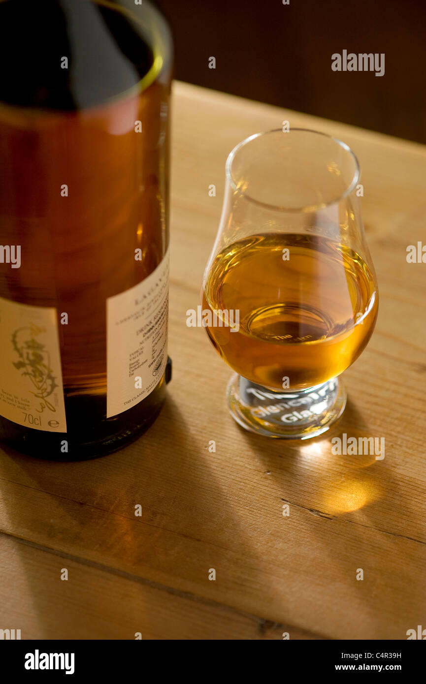 bottle and glass of scotch whisky on pub table Stock Photo - Alamy