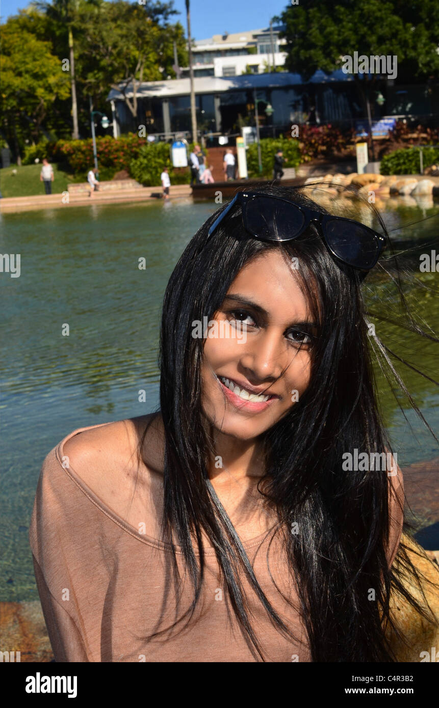 Beautiful young lady in front of water feature at South Bank in ...