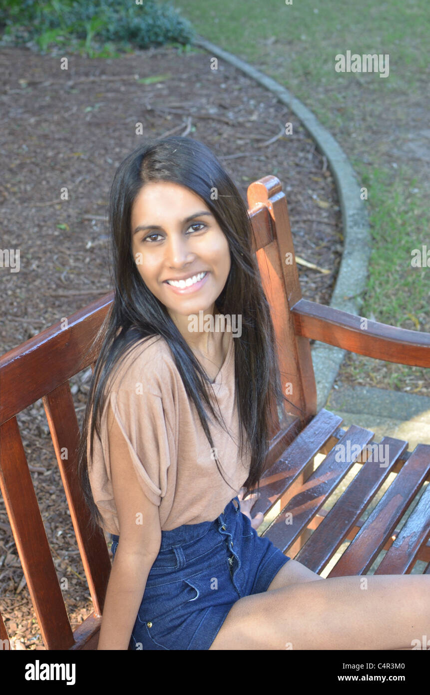 Attractive lady sitting on a bench at South Bank in Brisbane Stock ...