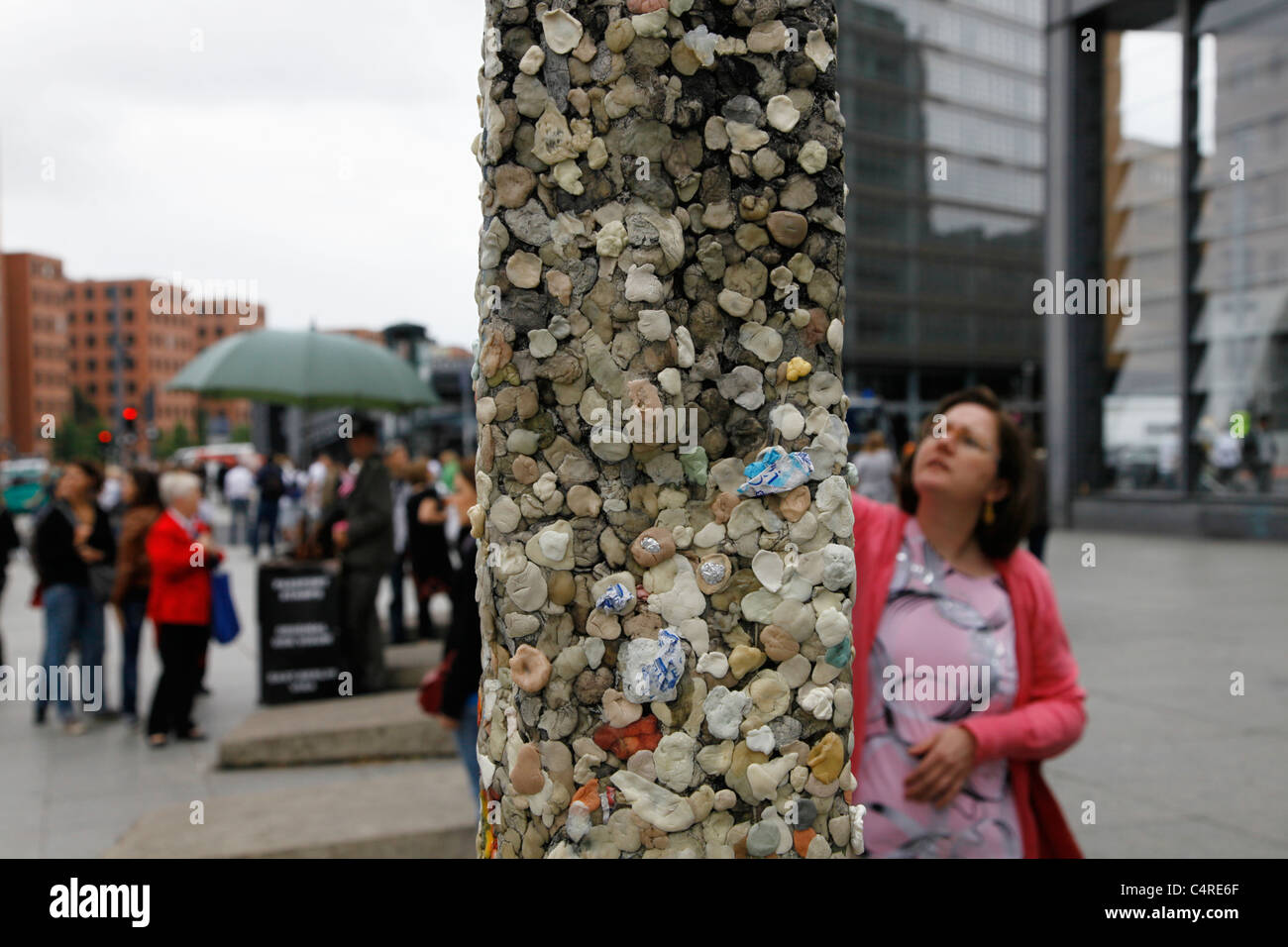 Chewing gum covers graffiti on a segment of the Berlin Wall placed as a ...