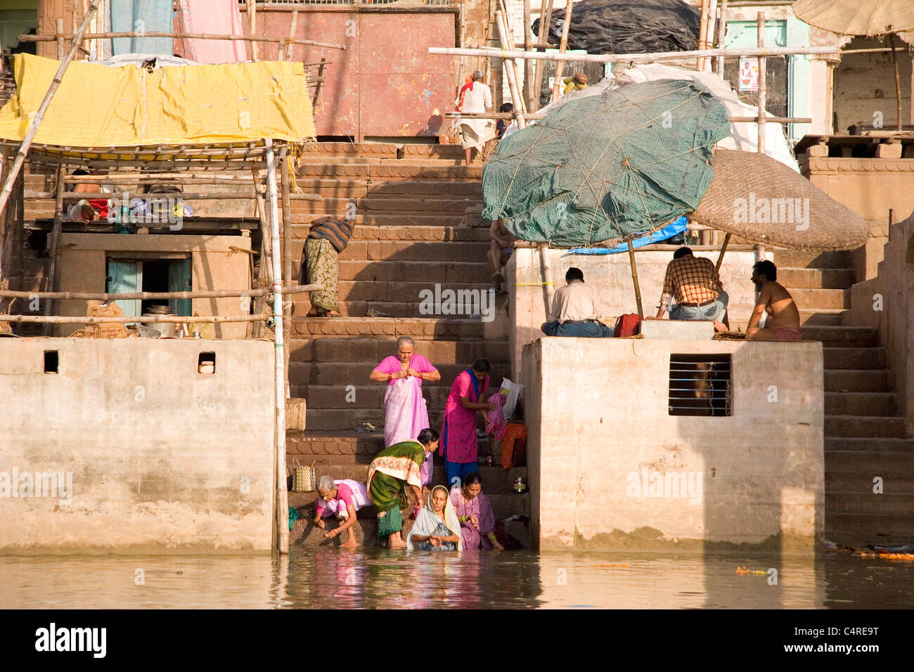 Women washing at waterfront along the Ganges River, Varanasi, India ...