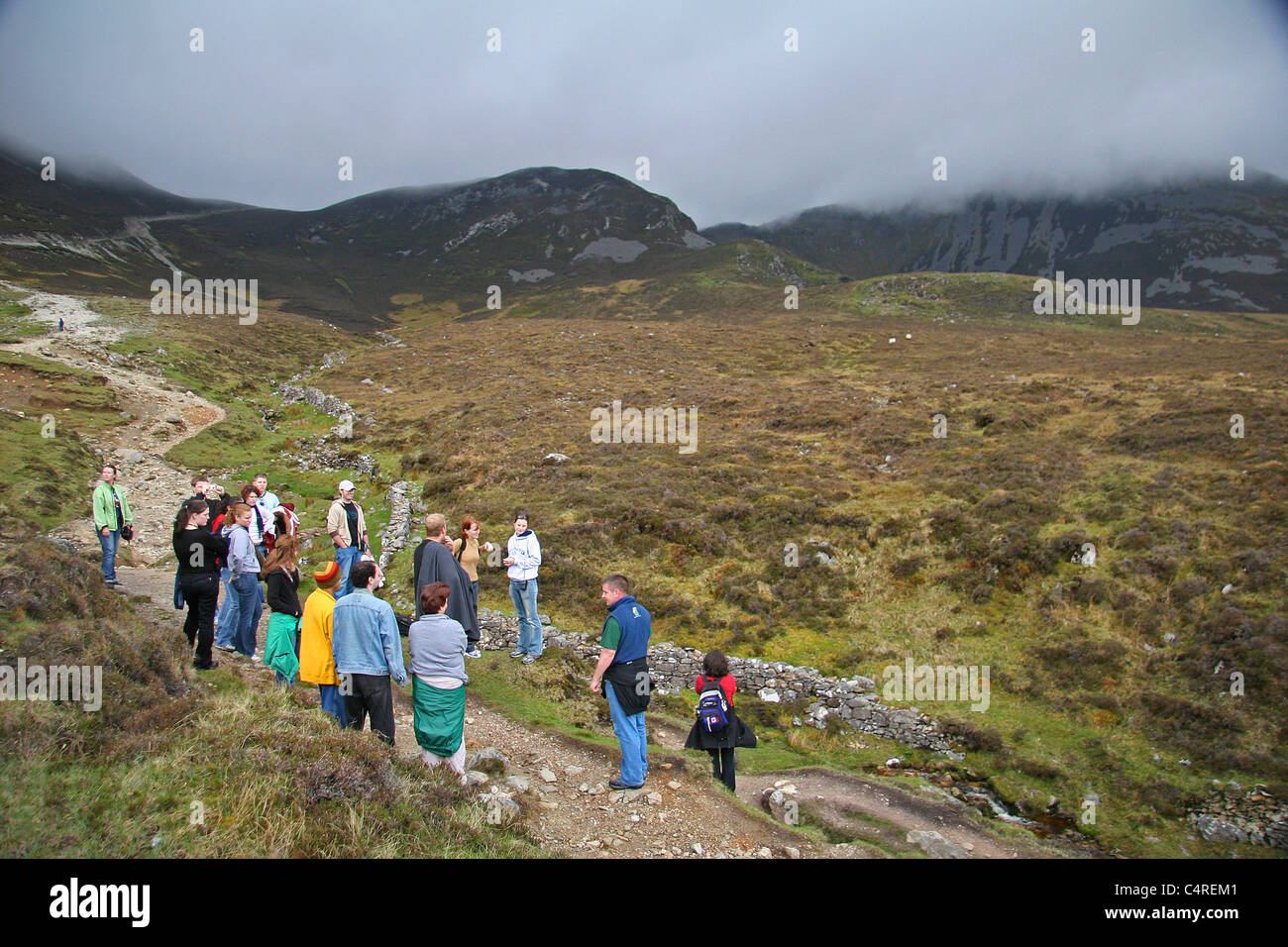 Group of people on path of Catholic pilgrimage, Connemara, Ireland ...
