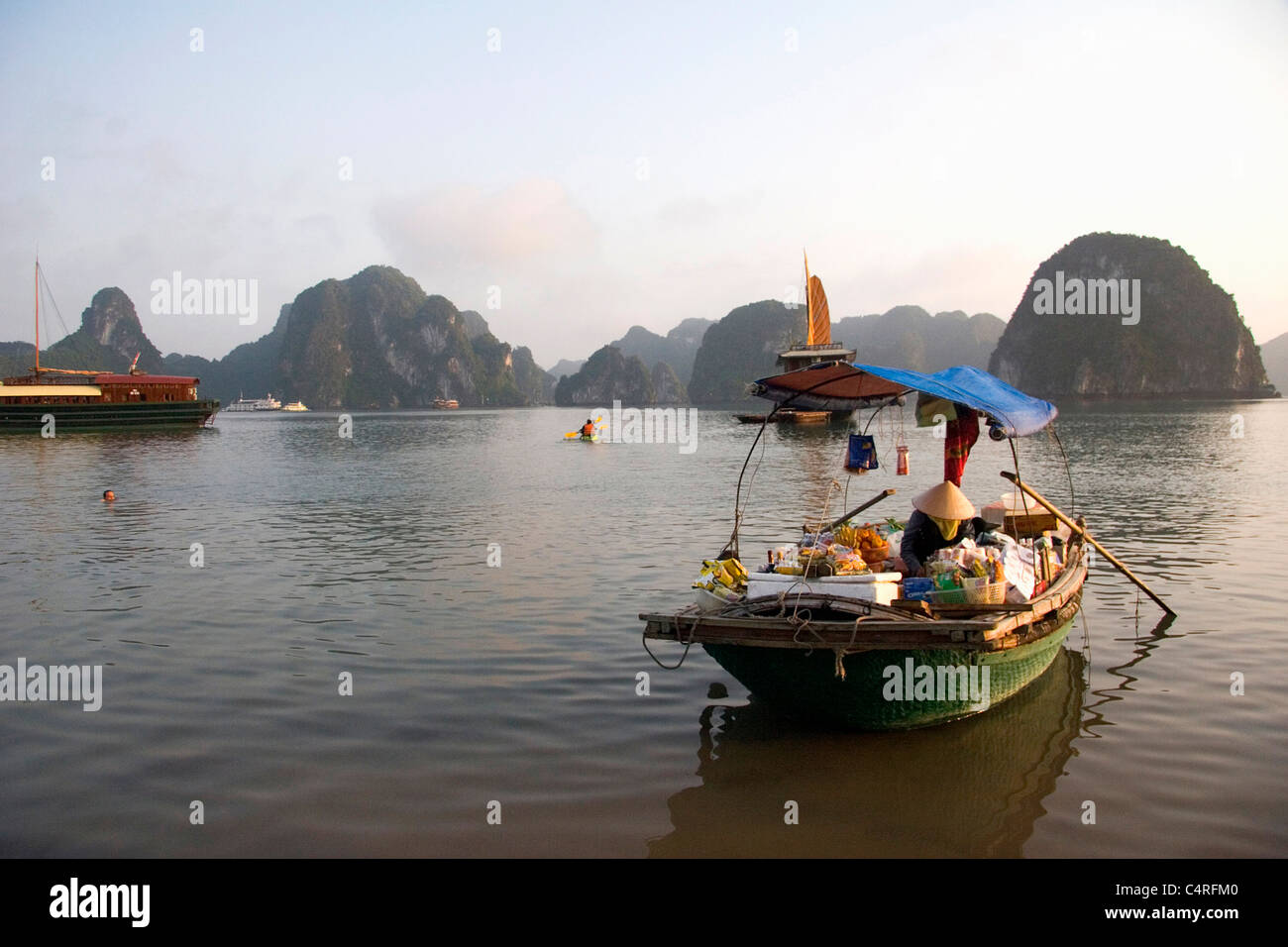 Vietnamese boat vendor on Ha Long Bay, Vietnam Stock Photo - Alamy
