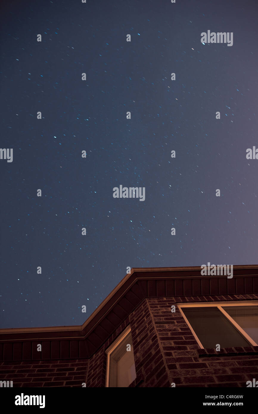 Night sky above suburban house Stock Photo - Alamy