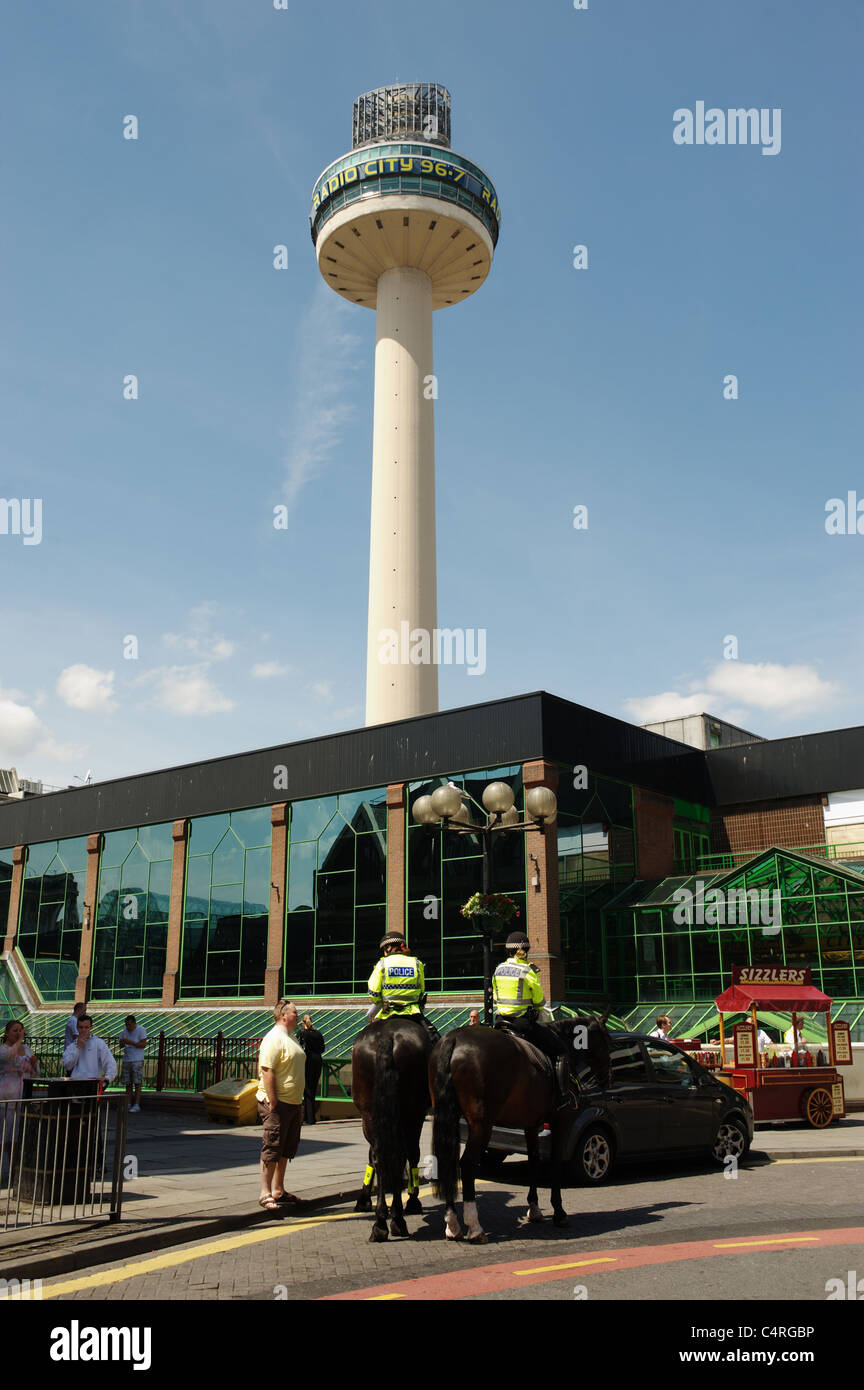 Horse mounted police officers in Liverpool city centre speaking to a ...