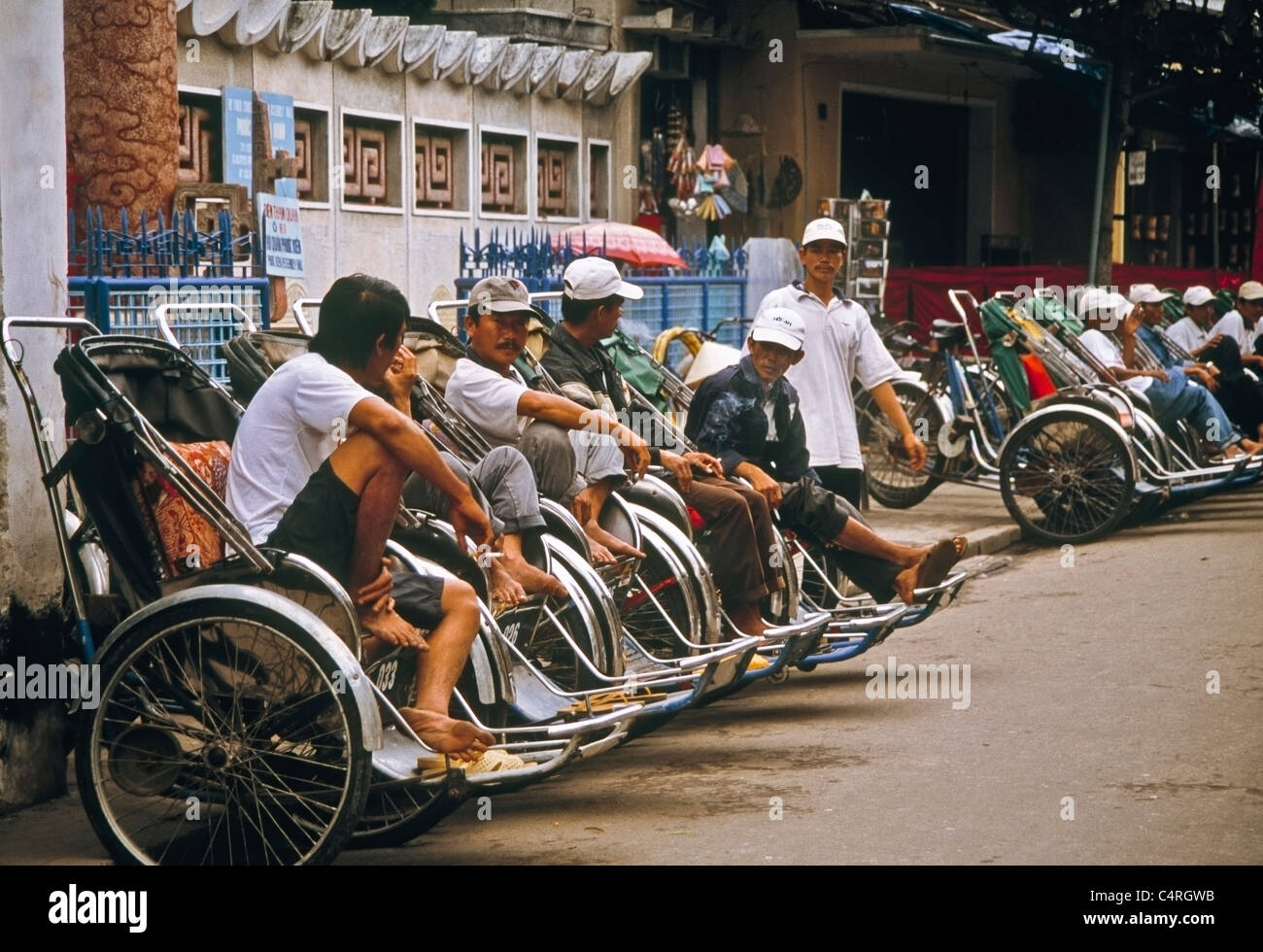 Rickshaw drivers waiting for custom, Vietnam Stock Photo - Alamy