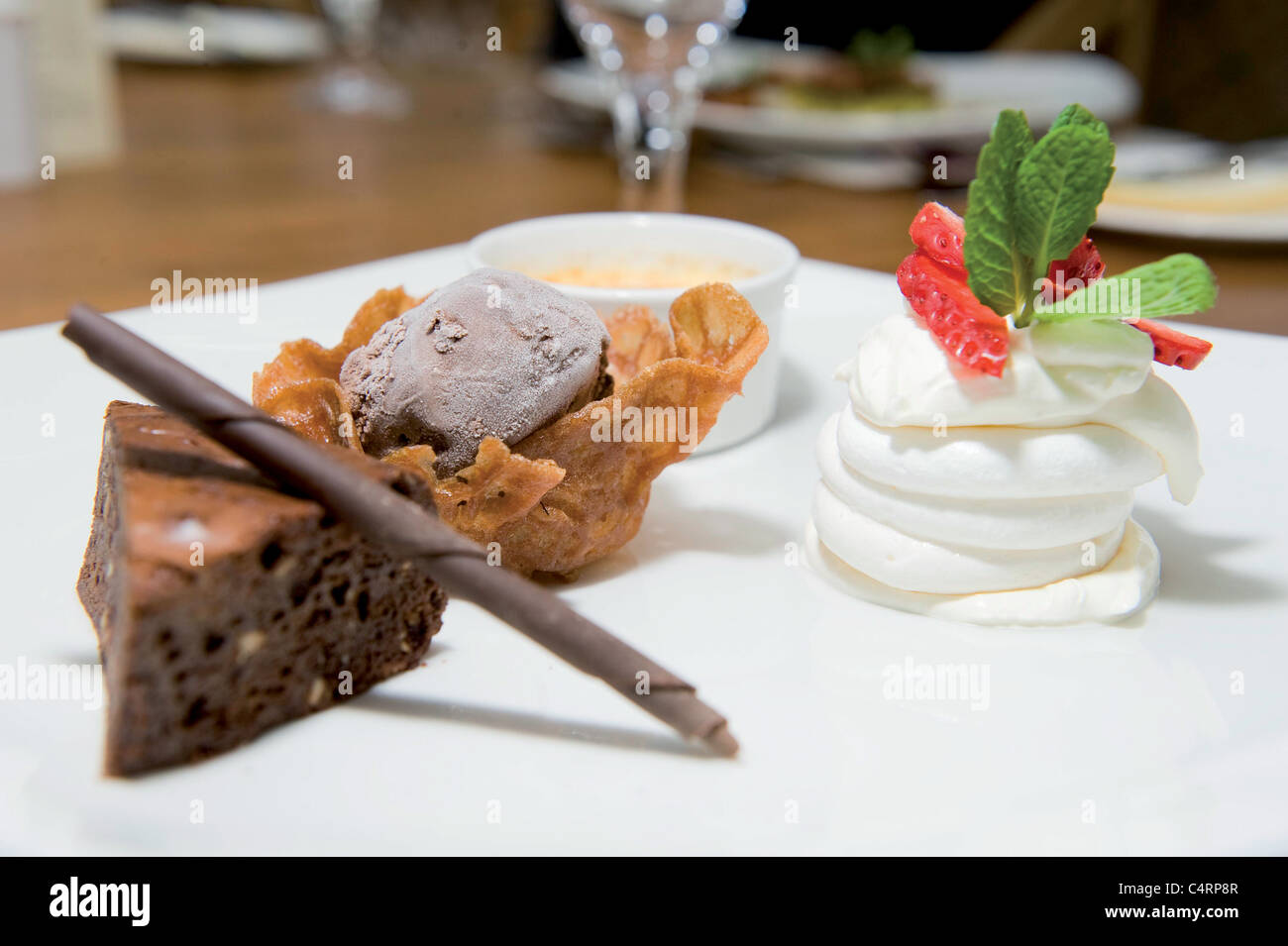 Trio of desserts chocolate meringue strawberry caramel pudding sweet ...