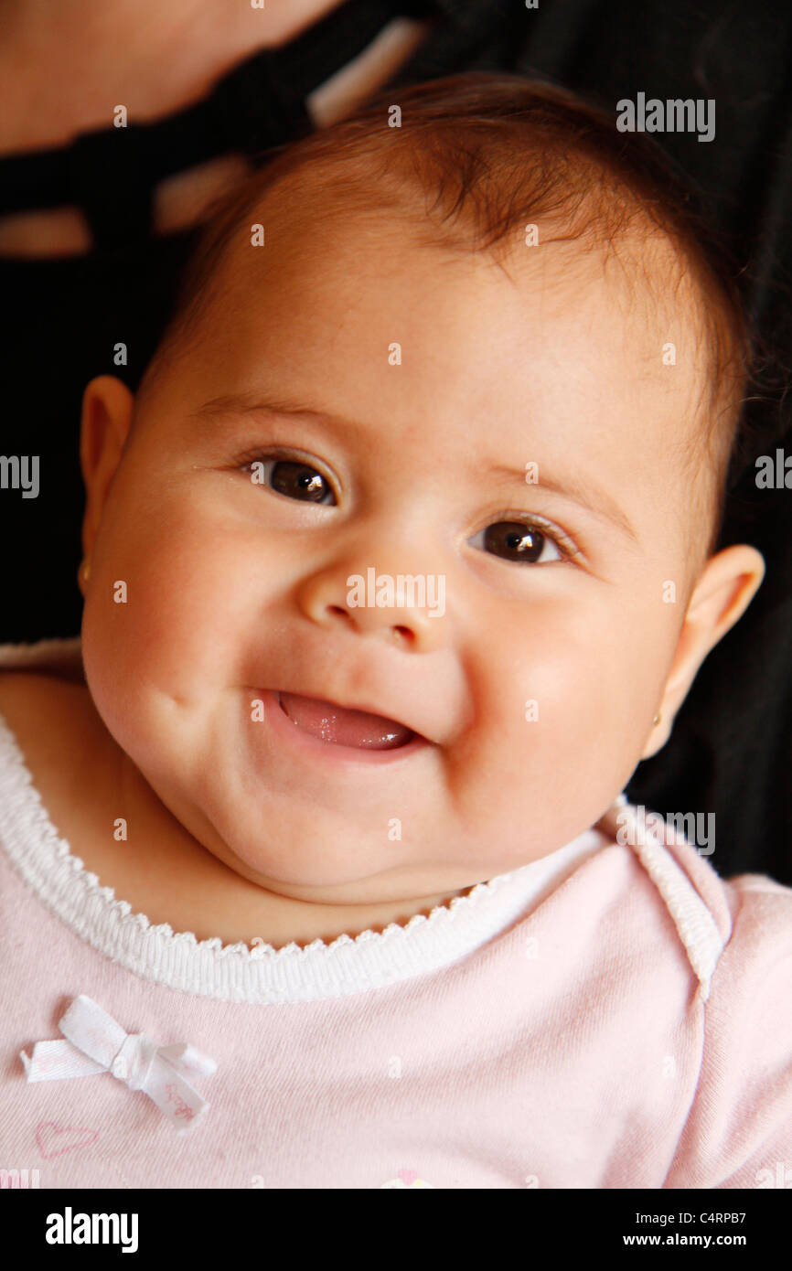 Baby looking at camera Stock Photo - Alamy