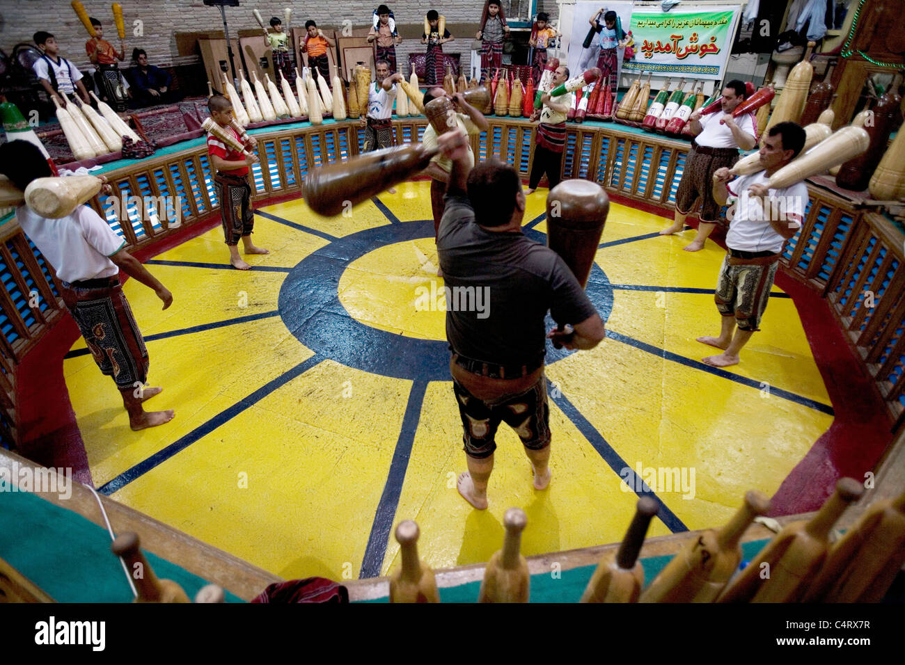 Men practising zurkhaneh (traditional Iranian dance/sports), Yazd, Iran ...