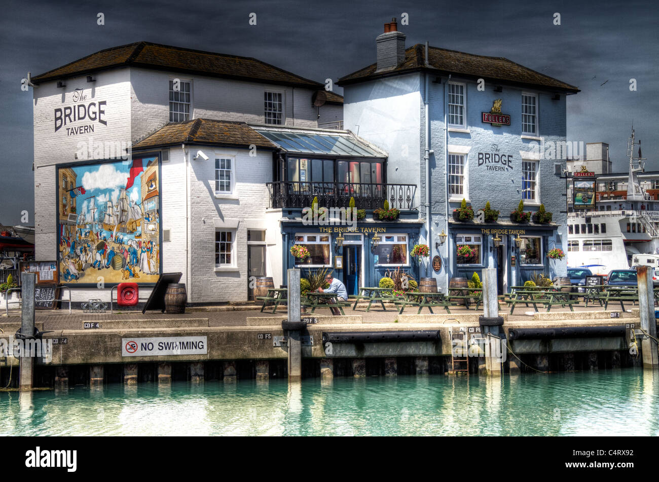 The Bridge Tavern at Old Portsmouth with Camber Dock in the foreground ...