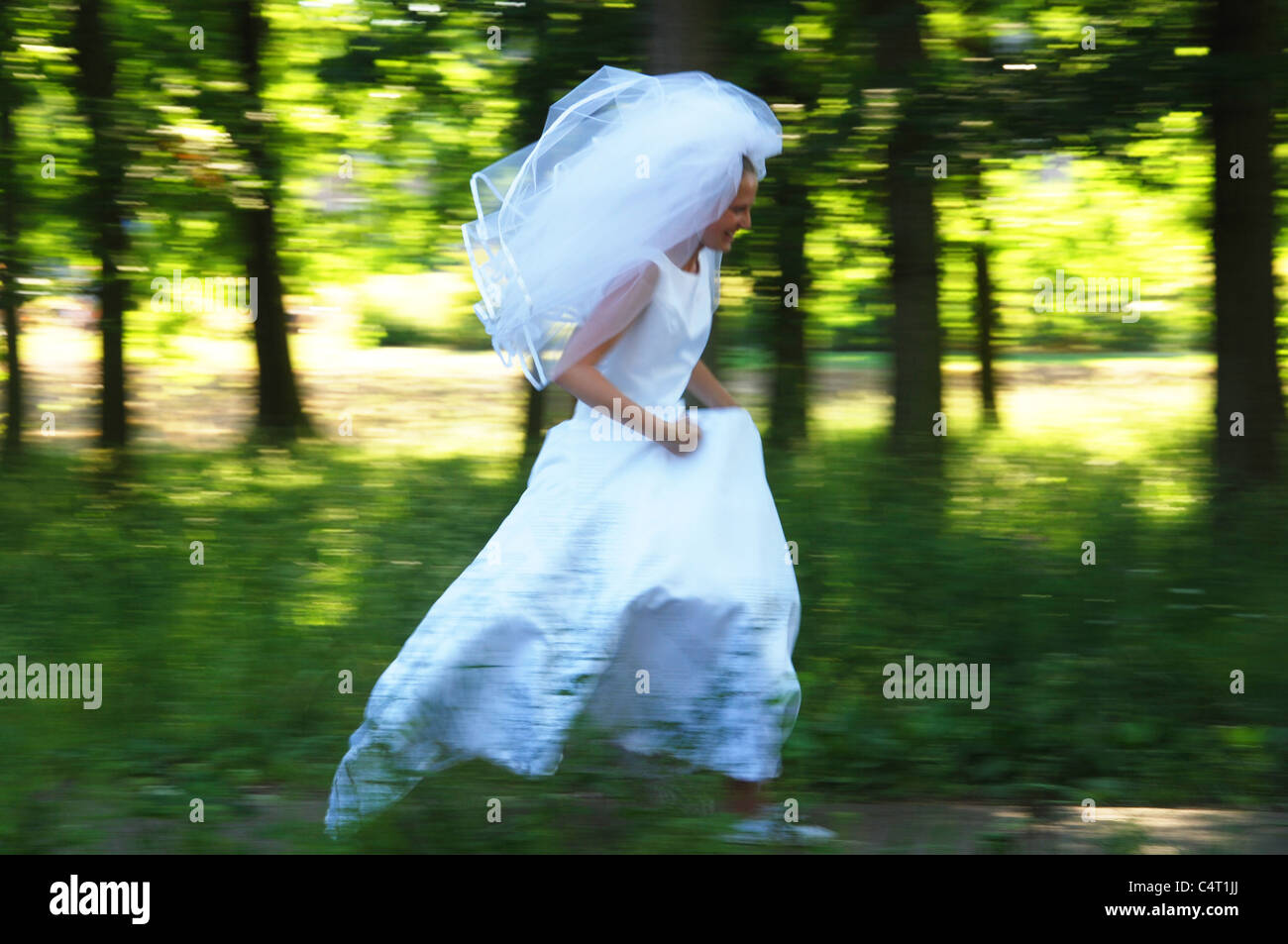 runaway bride in the woods Stock Photo - Alamy