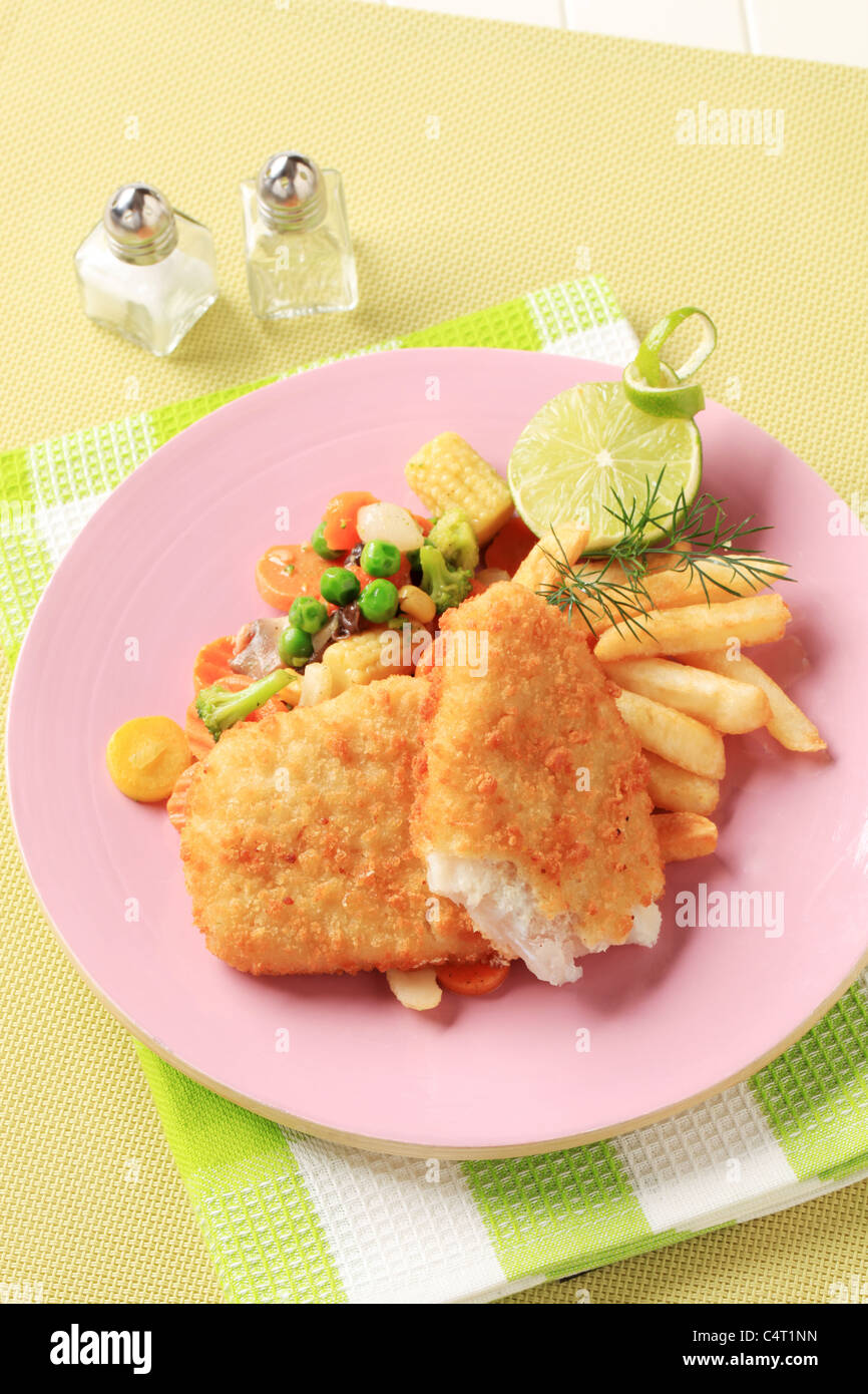 Fried fish served with French fries and mixed vegetables Stock Photo ...