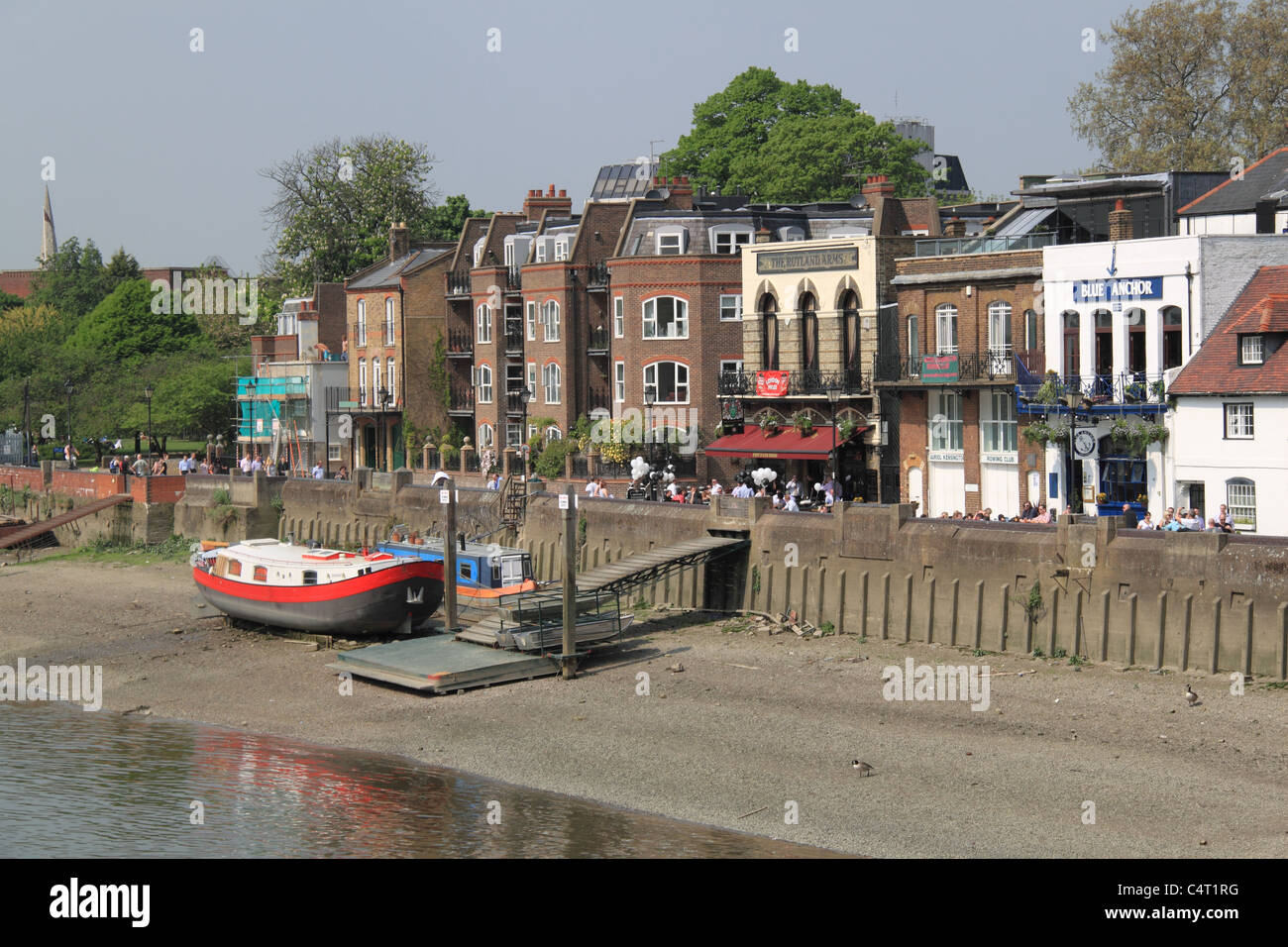 Riverside pubs and houseboat on River Thames, Hammersmith, west London ...