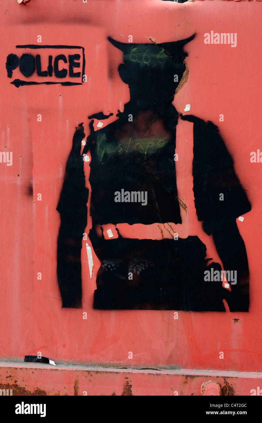 Stencil graffiti of a policeman Stock Photo - Alamy