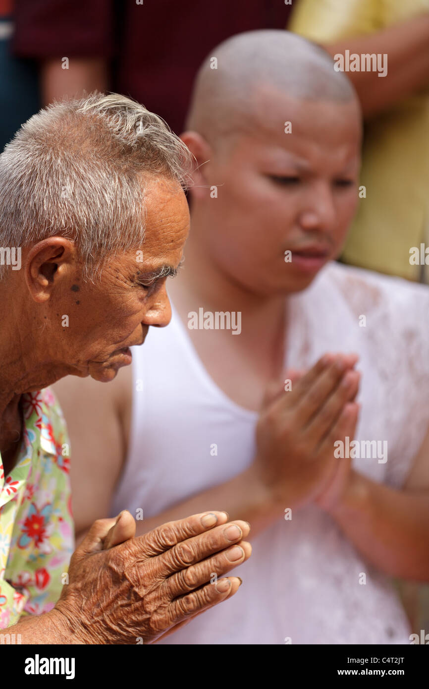 The monk is praying officially for the first time during this ceremony ...