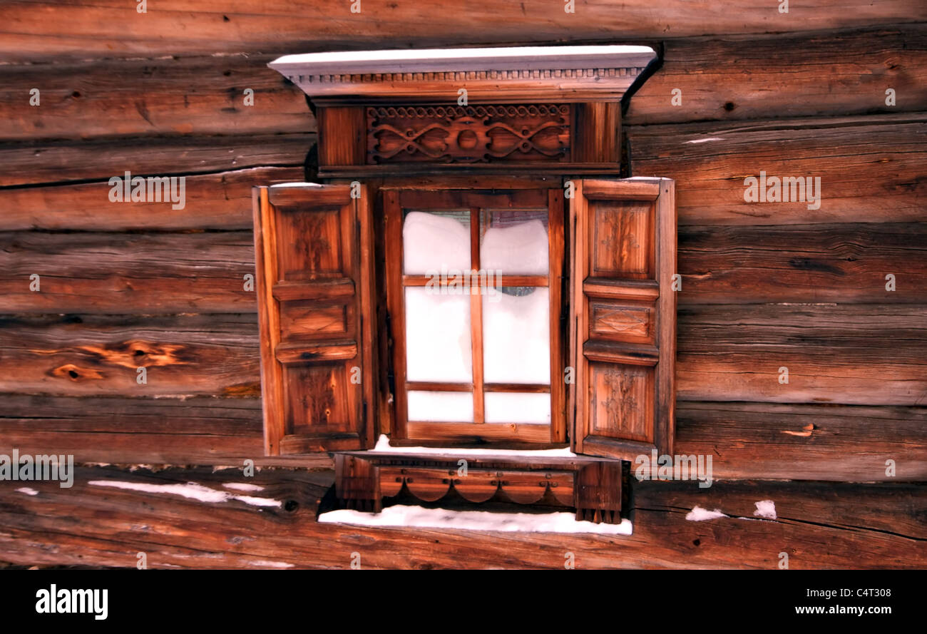 Wood window in russian village. Frozen ice on glass. Russia country in ...