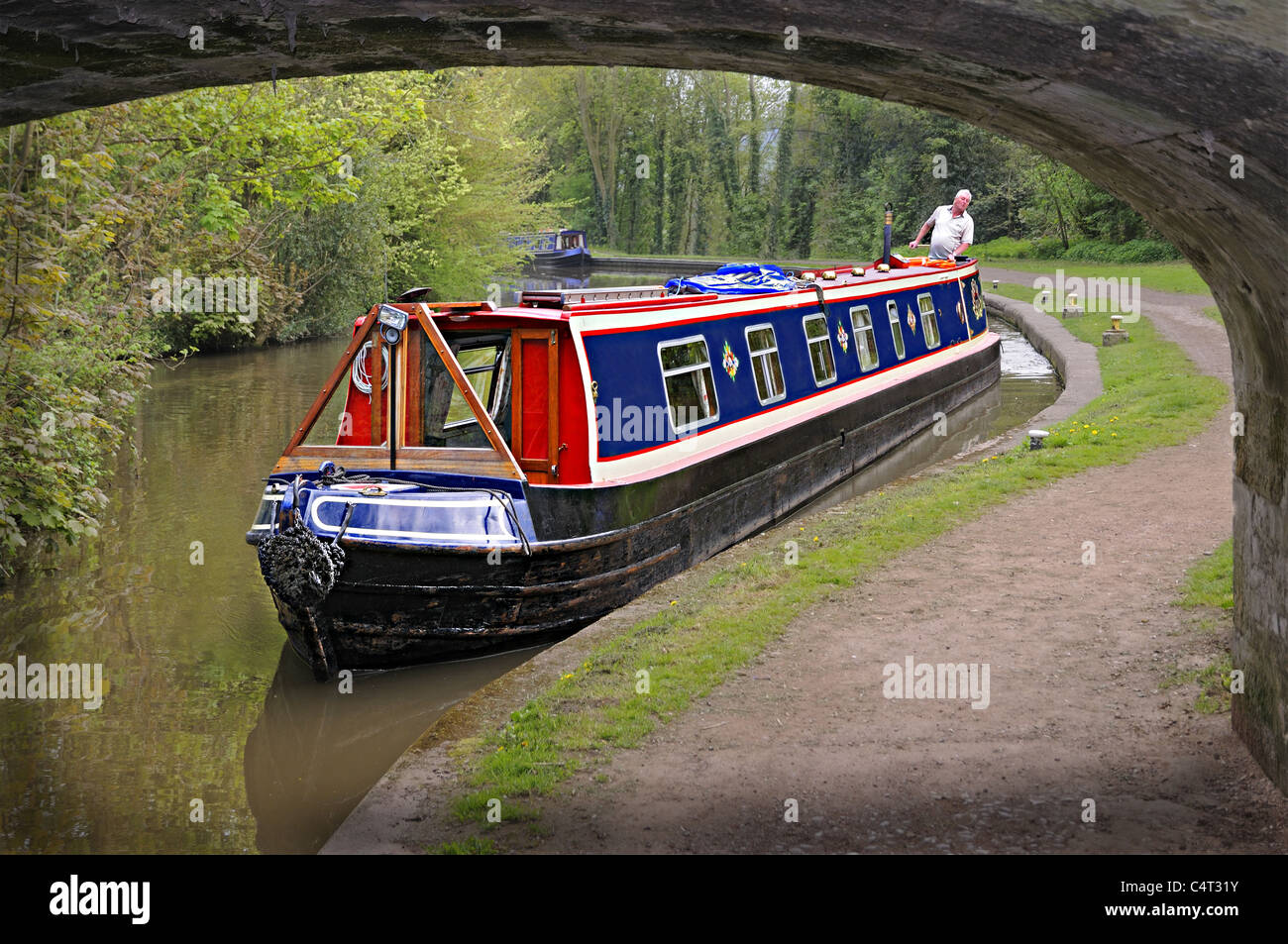 Narrowboat about to go under bridge over Trent and Mersey Canal at ...
