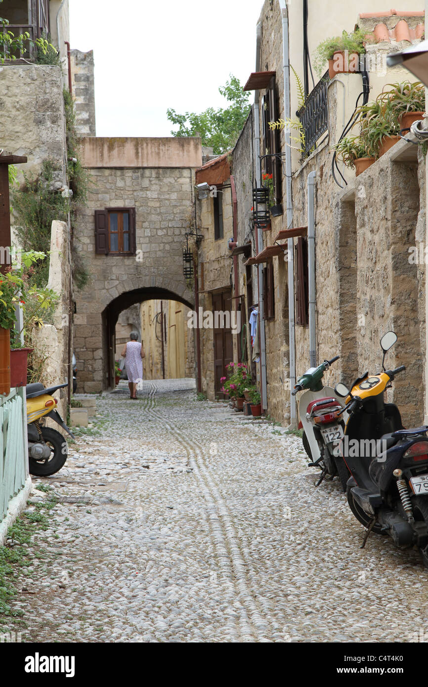 Alley in Crete, Greece with traditional square paving stones Stock ...