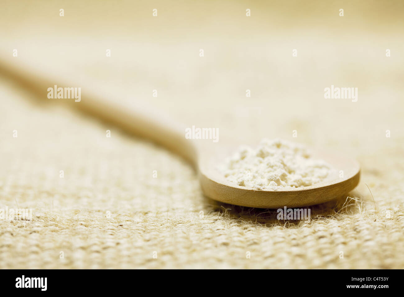 flour in a spoon on a linen fabrics Stock Photo - Alamy