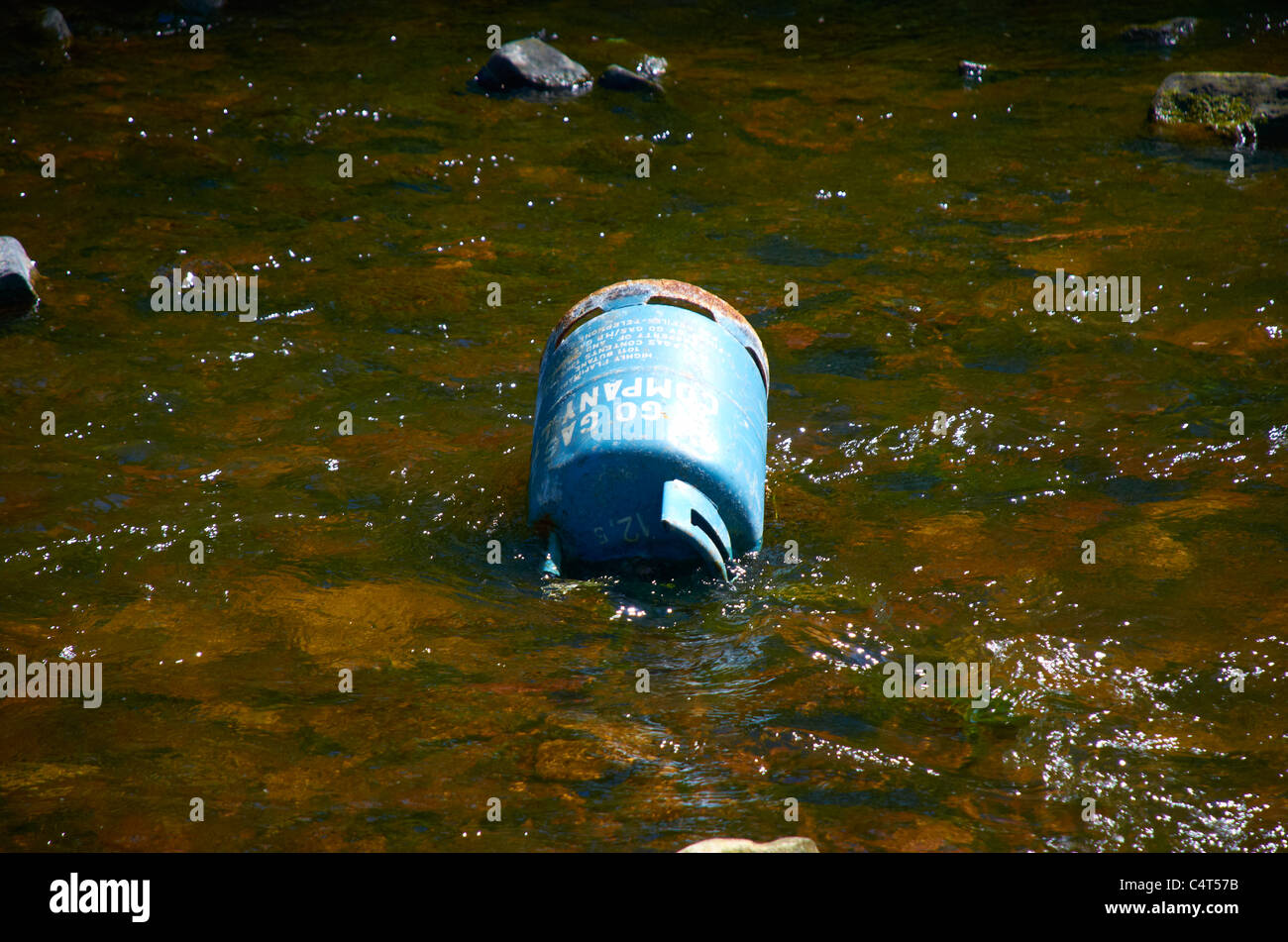 gas bottle dumped in a river Stock Photo - Alamy