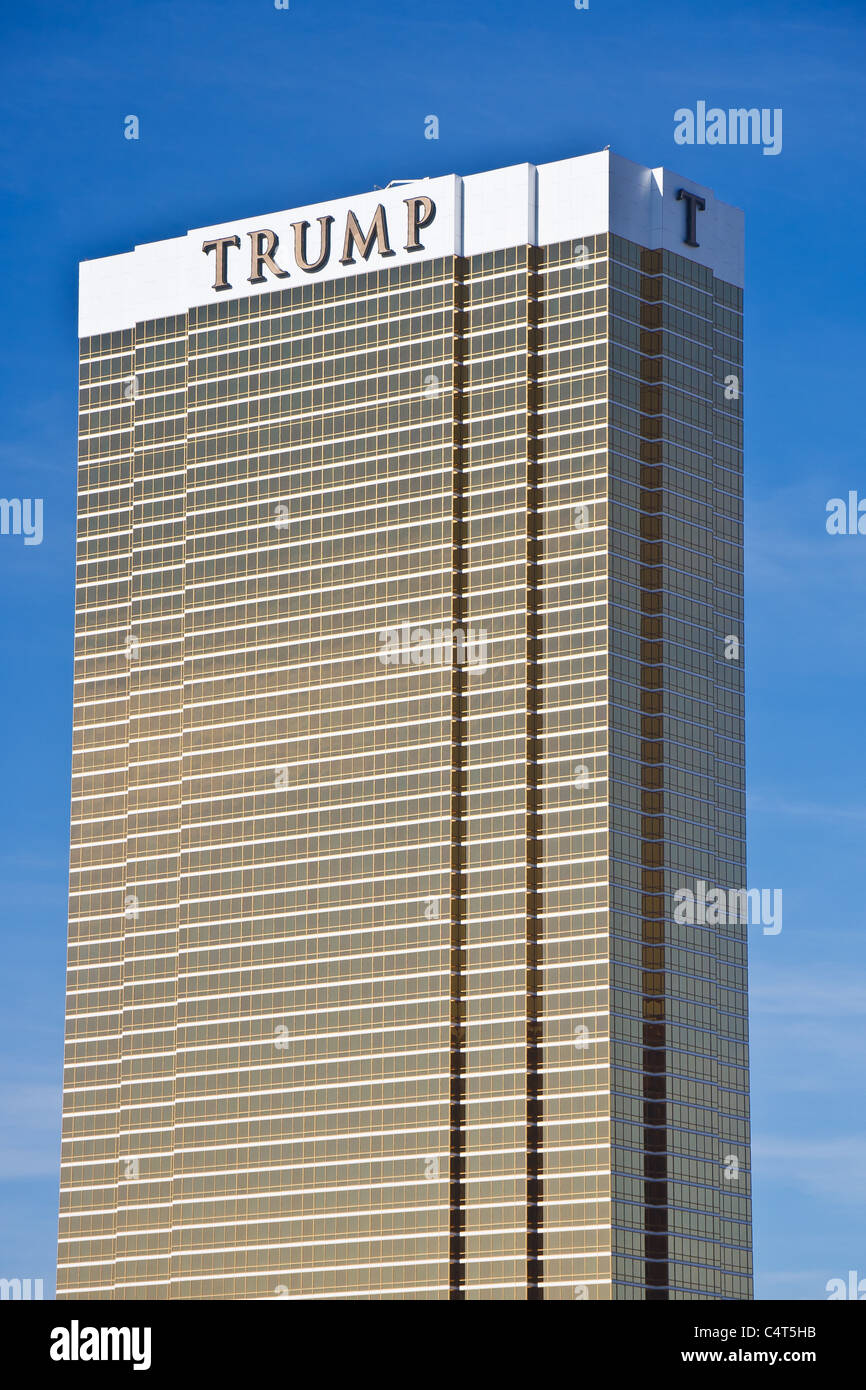 A high rise luxury hotel rising into a blue sky Stock Photo - Alamy