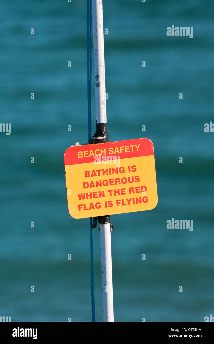 Beach Safety sign, bathing is dangerous when the red flag is flying ...